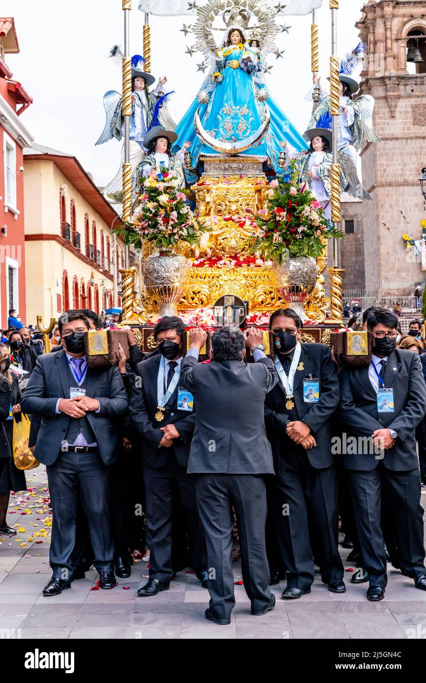 A Statue Of The Virgin Mary Is Carried Through The Streets Of Puno ...