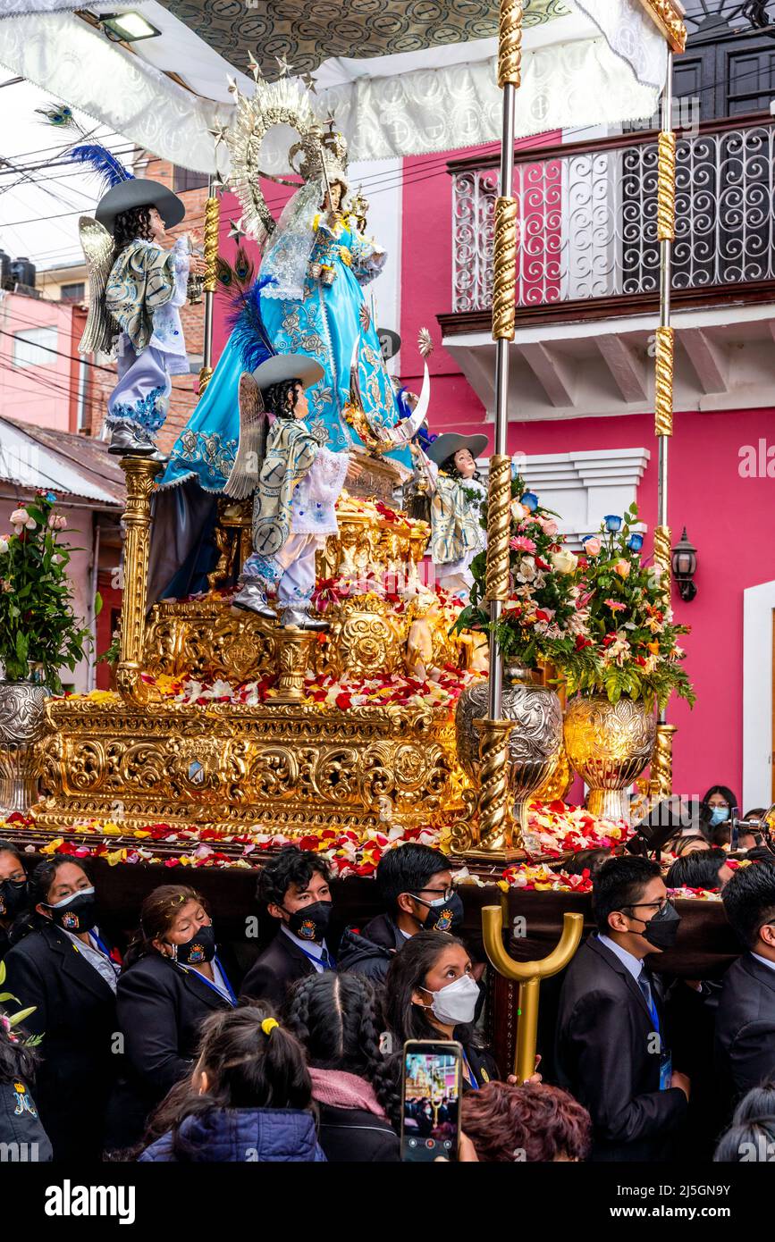 A Statue Of The Virgin Mary Is Carried Through The Streets Of Puno ...