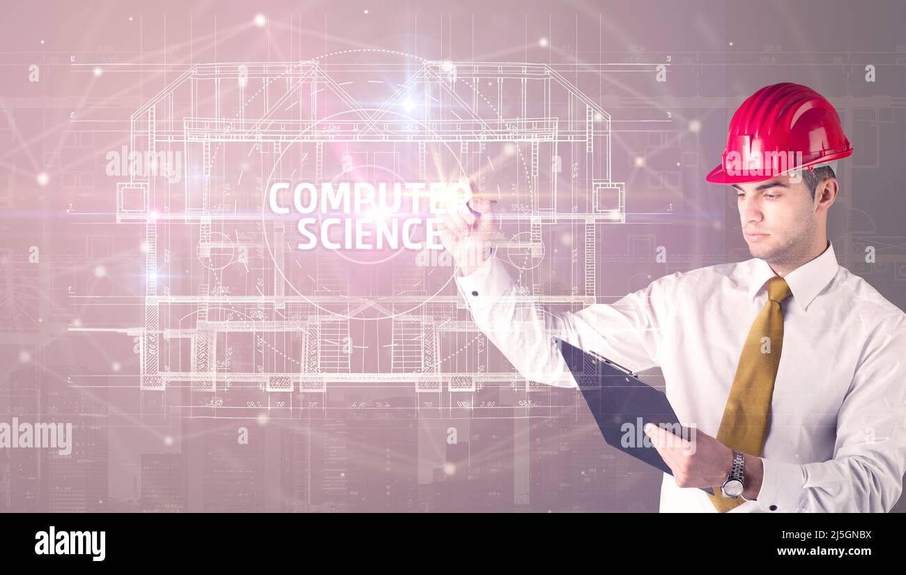 Handsome architect drawing with helmet Stock Photo - Alamy