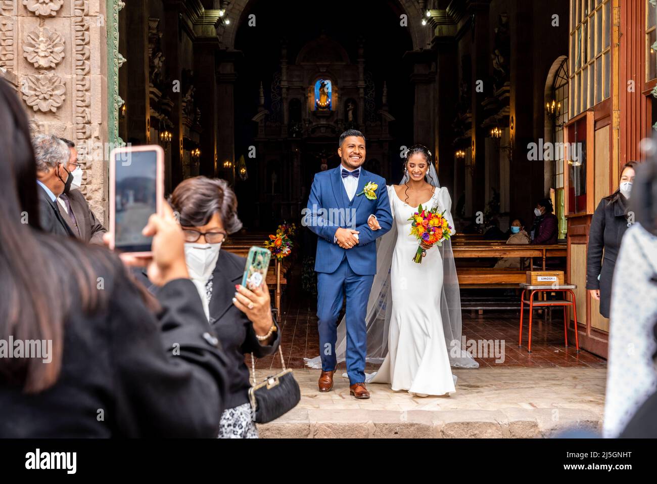A Young Peruvian Couple Leave The Cathedral After Getting Married, The ...