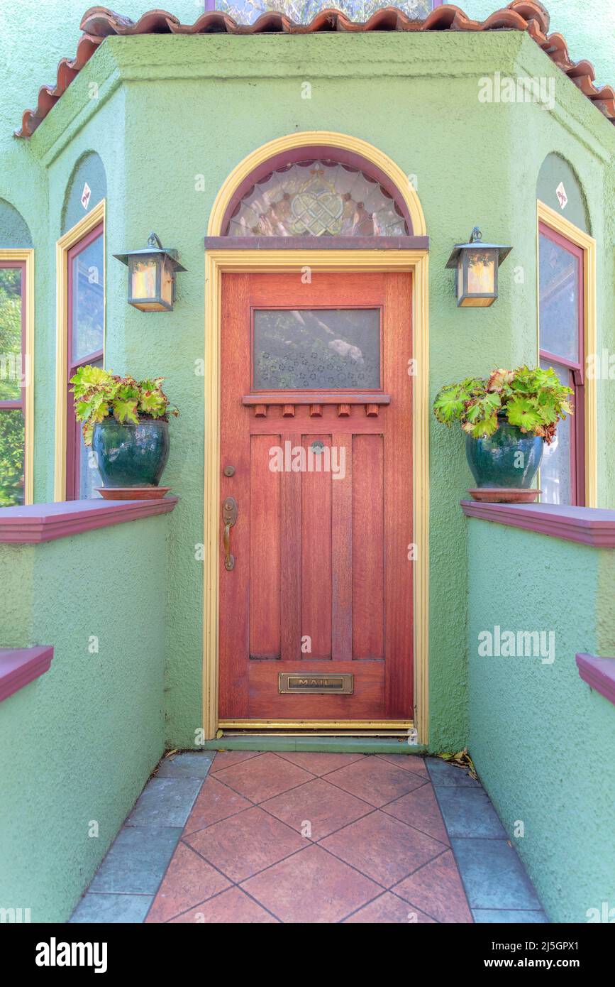 Entrance of a house with mediterranean structure and green exterior at ...