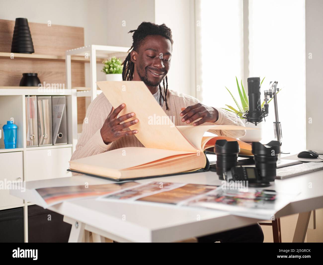 Graphic designer/photographer working in home office Stock Photo - Alamy