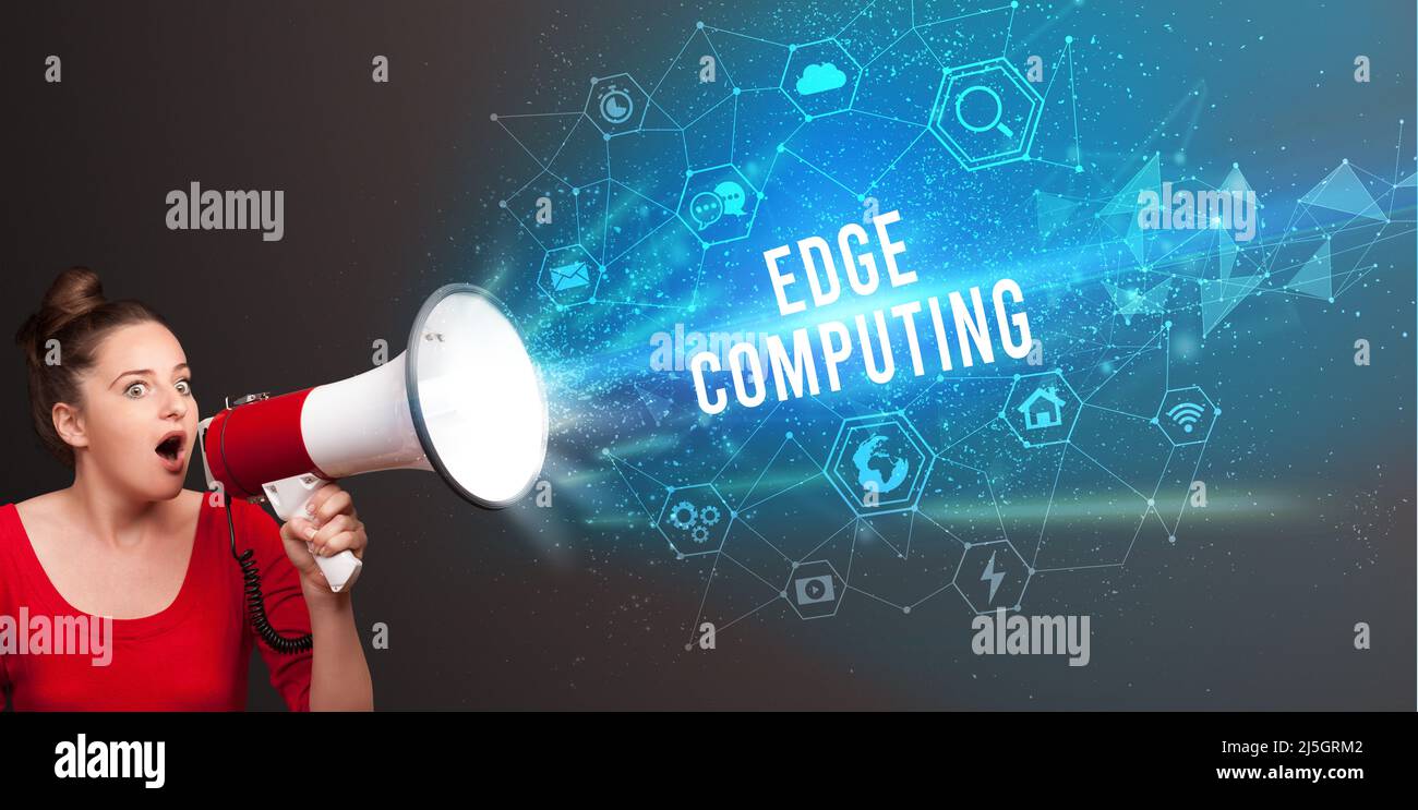 Young woman shouting in megaphone, technology announcement concept ...