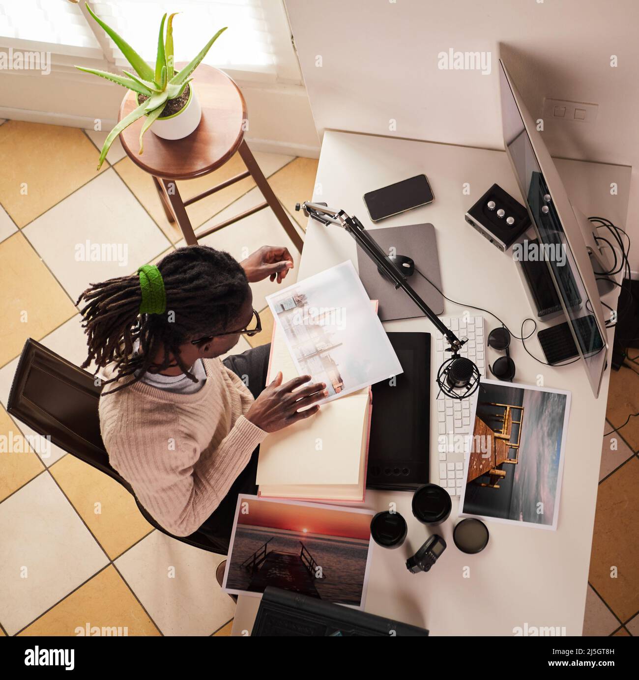 Graphic designer/photographer working in home office Stock Photo - Alamy