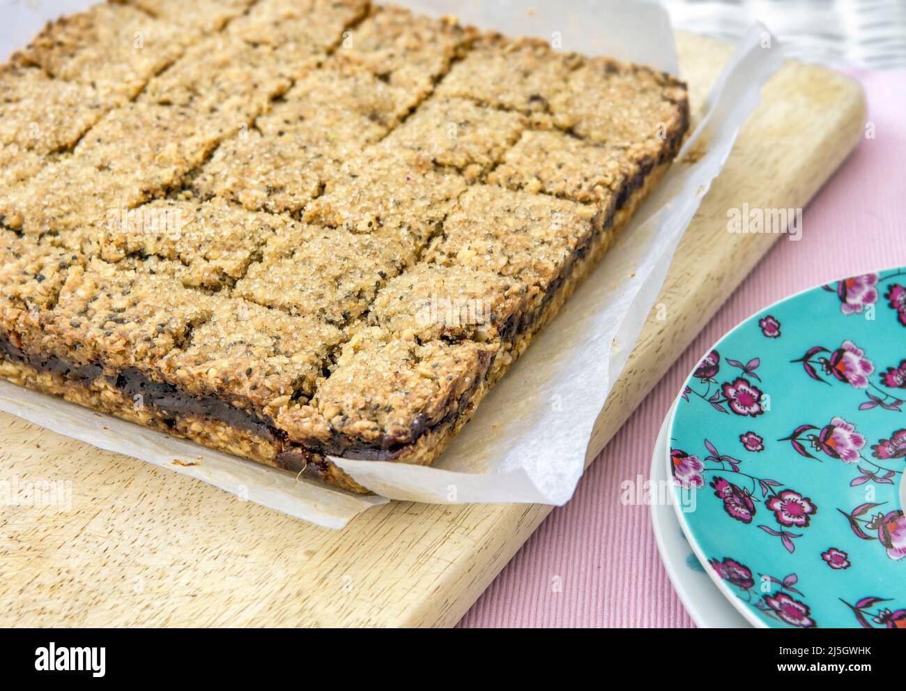 Home made tray bake of Date and Oat slices. Cut into squares Stock ...