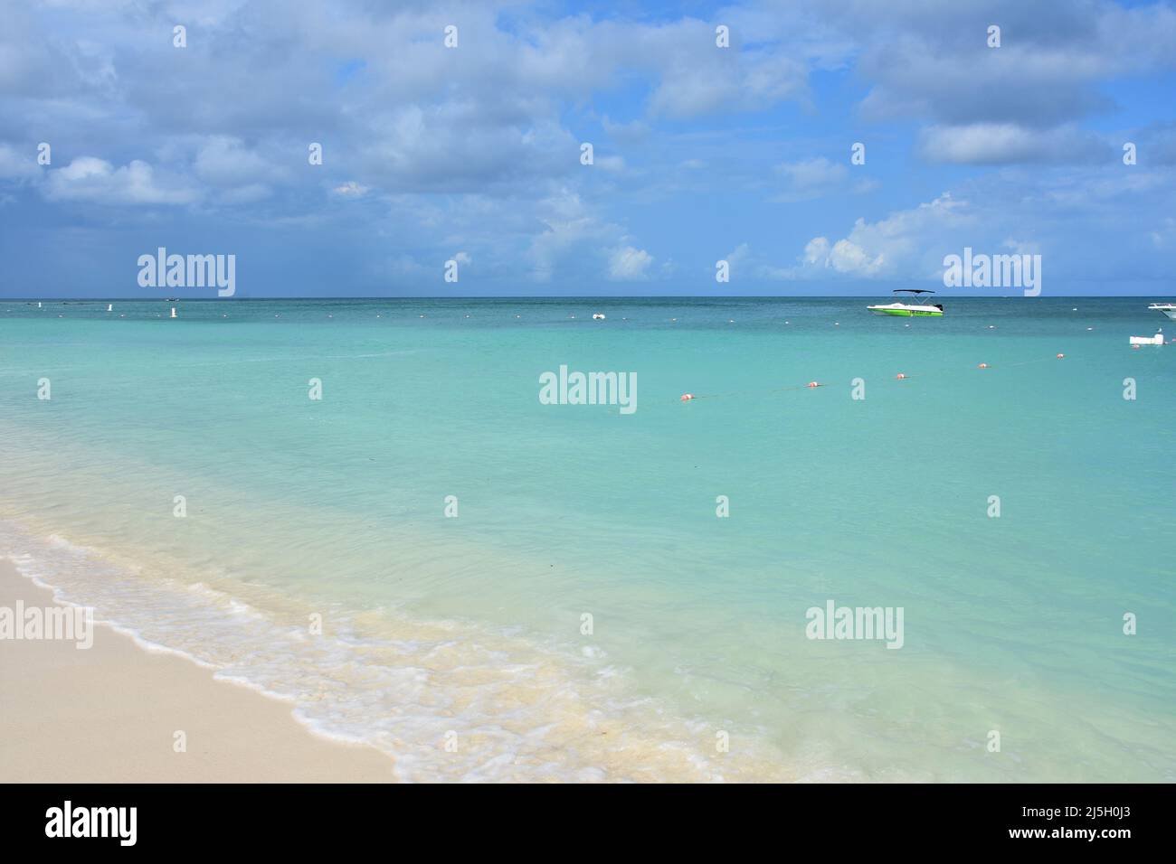 Beautiful aqua water with waves gently lapping the shore of Aruba Stock ...