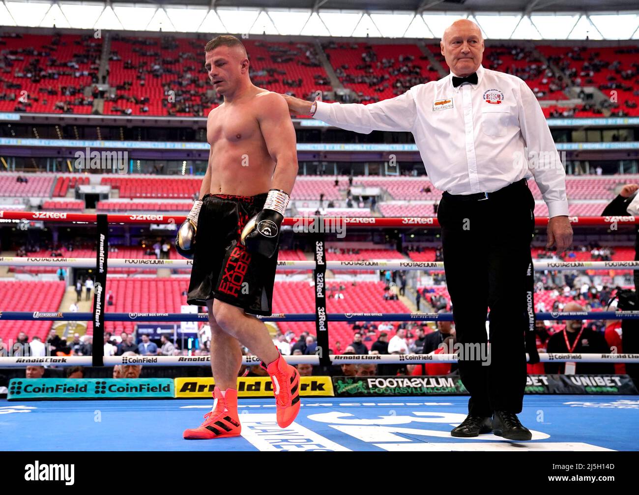 Michal Ciach is comforted by the referee after losing his Light ...