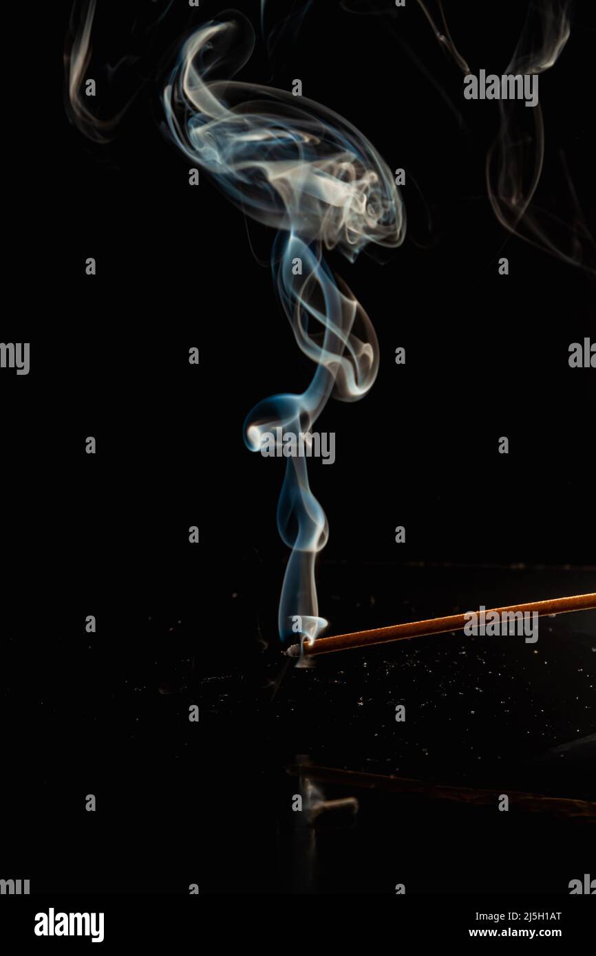 Blue wisp of smoke on black background Stock Photo - Alamy