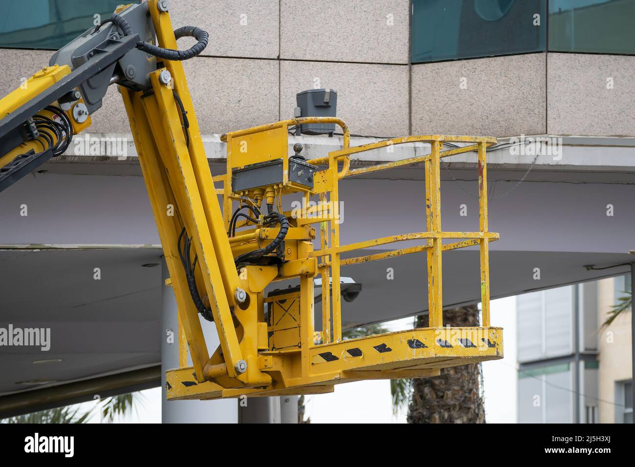 closeup in horizontal view of the basket of an articulated boom lift of ...