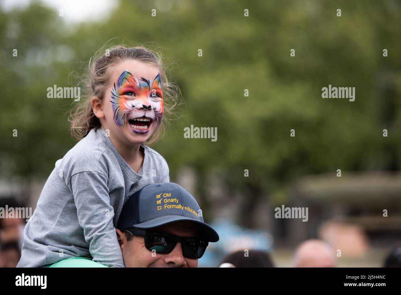 A girl with face painting celebrates St George's Day. St George's Day ...