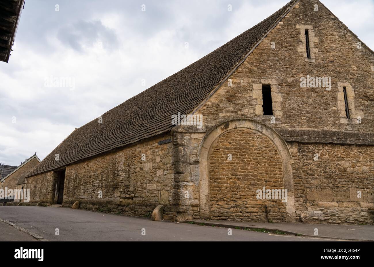 the famous tithe barn in the English historic village of Lacock ...