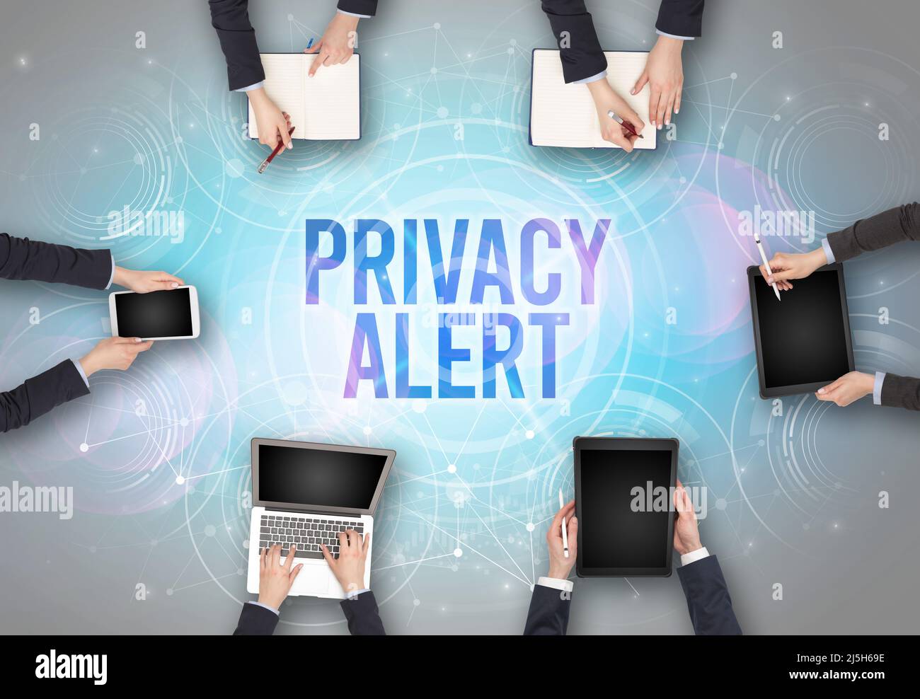 Group of people in front of a laptop, security concept Stock Photo - Alamy