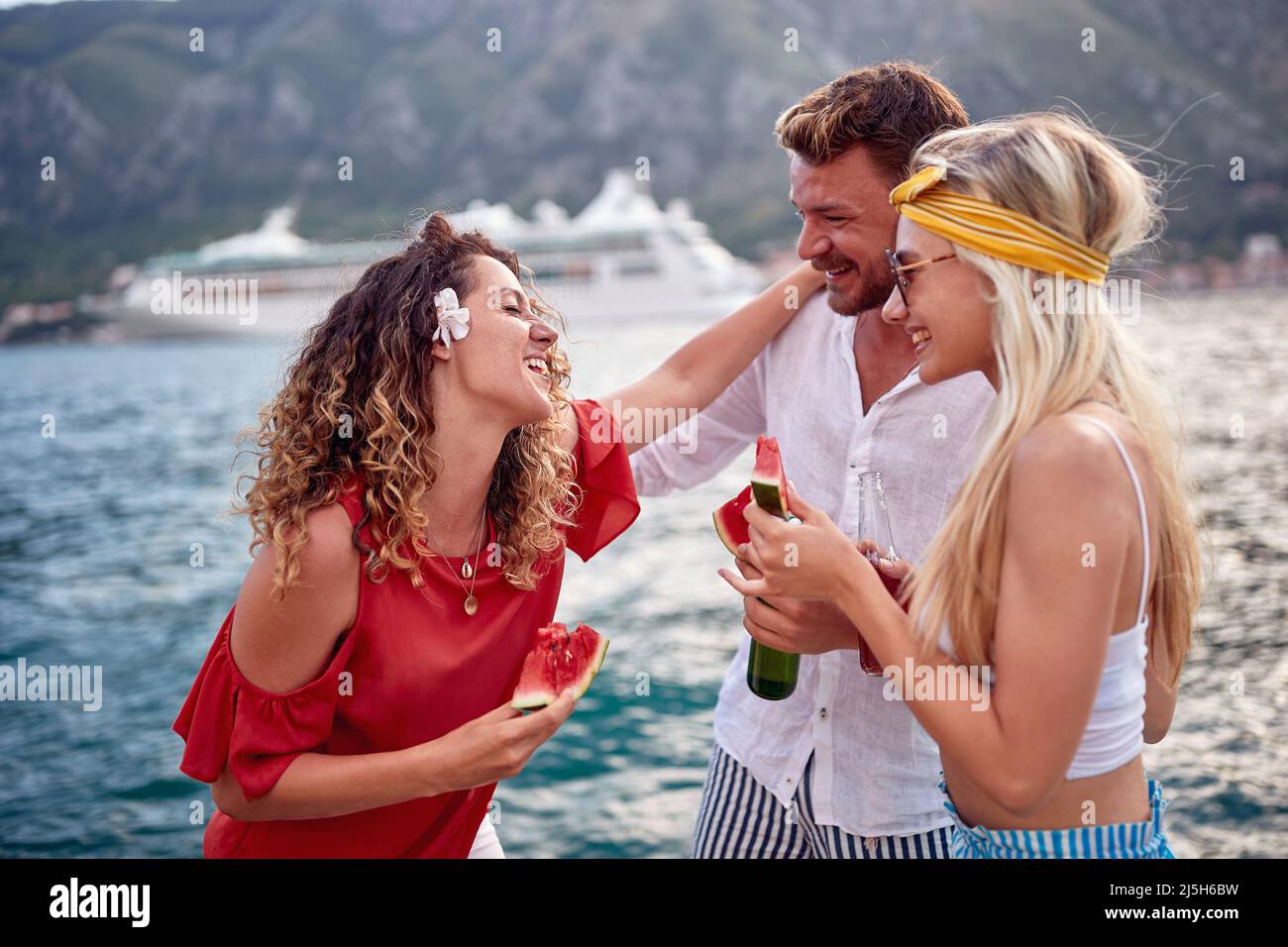 Young boho style group of friends on summer holiday together. Being ...