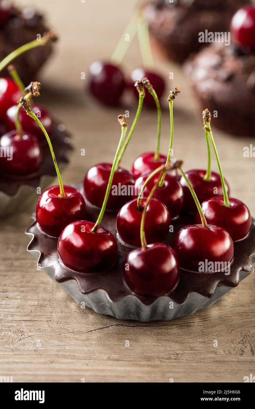 ripe red cherry in a chocolate tart background Stock Photo - Alamy