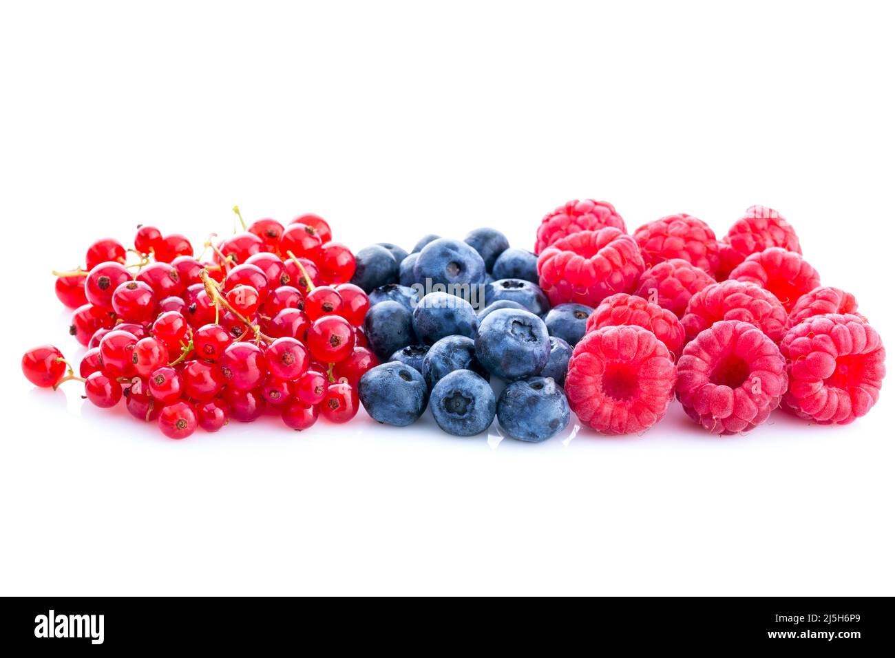 Stack of different berries isolated on white background Stock Photo - Alamy