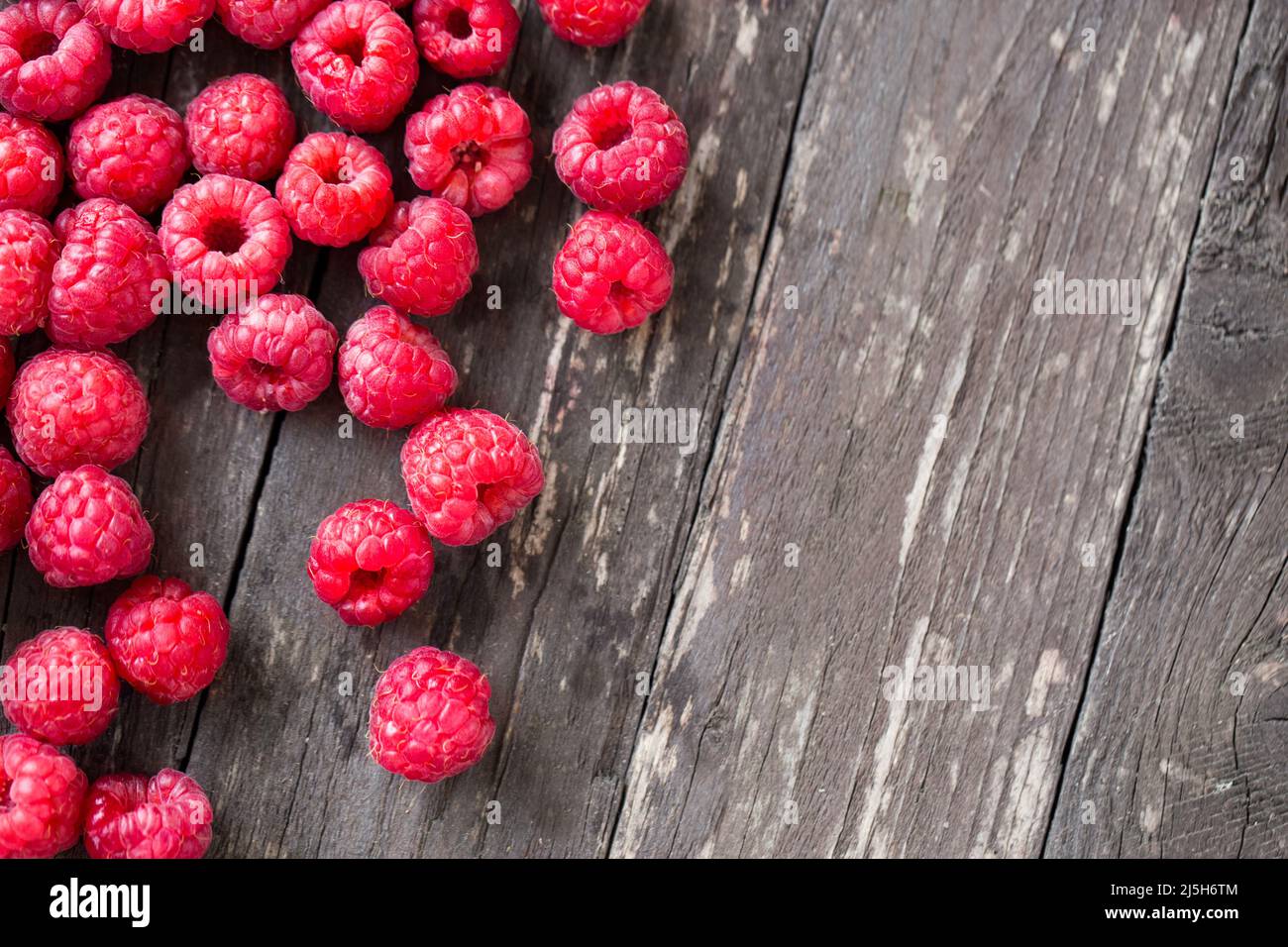 fresh raspberry on wood background Stock Photo - Alamy