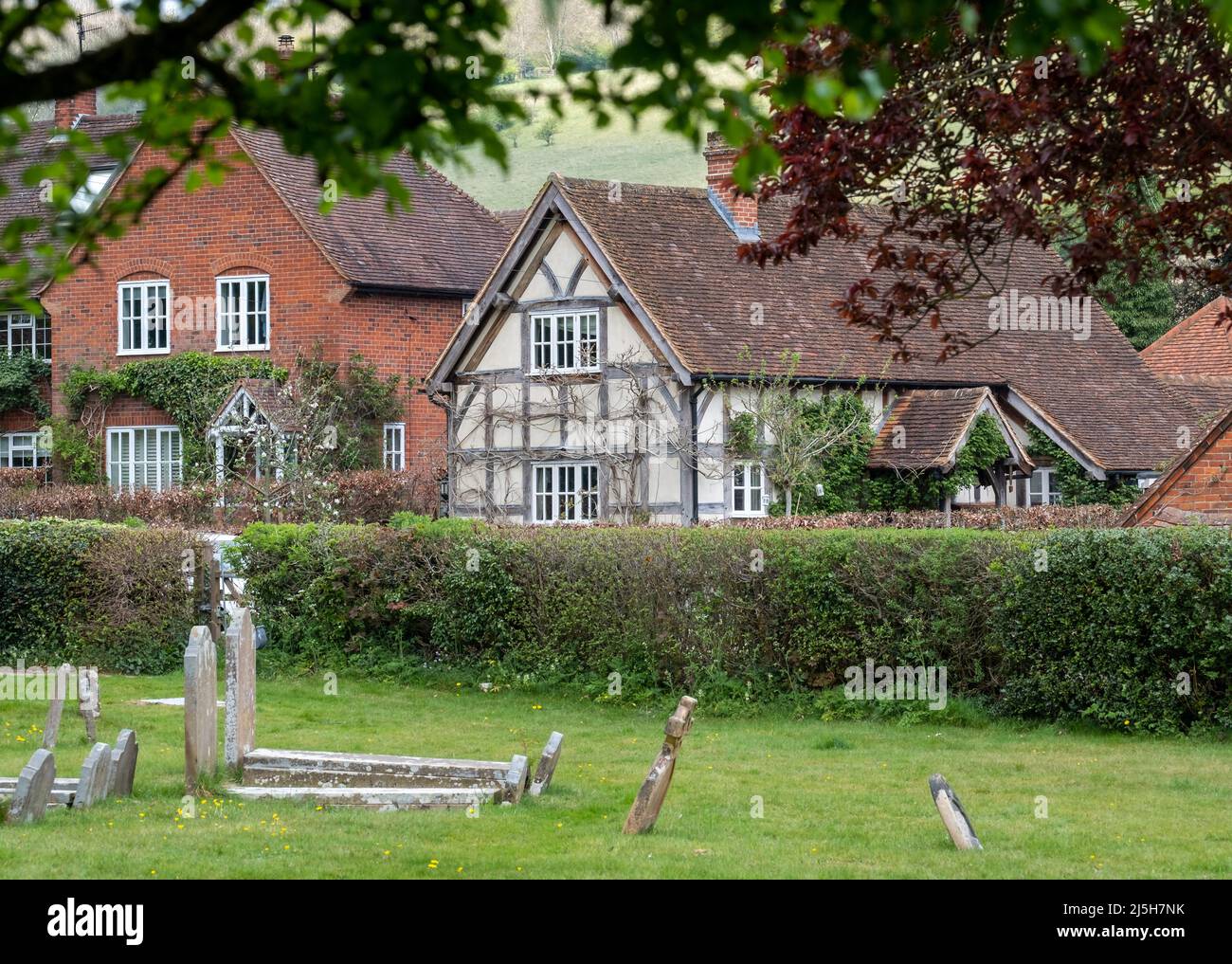 In the foreground, graves in the grounds of St Mary the Virgin Church ...