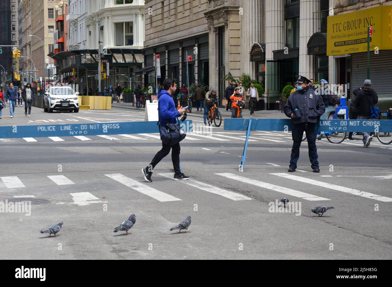 Empty streets and people are are seen walking in midtown Manhattan on ...