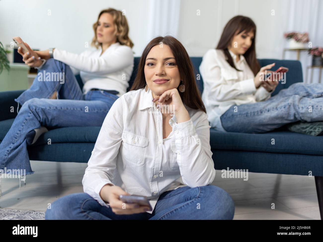 Three dependent adult enthusiastic girls - friends in stylish neat ...