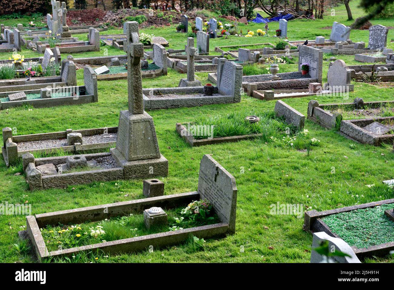 Typical English village graveyard with tombstones, Winterbourne Down ...
