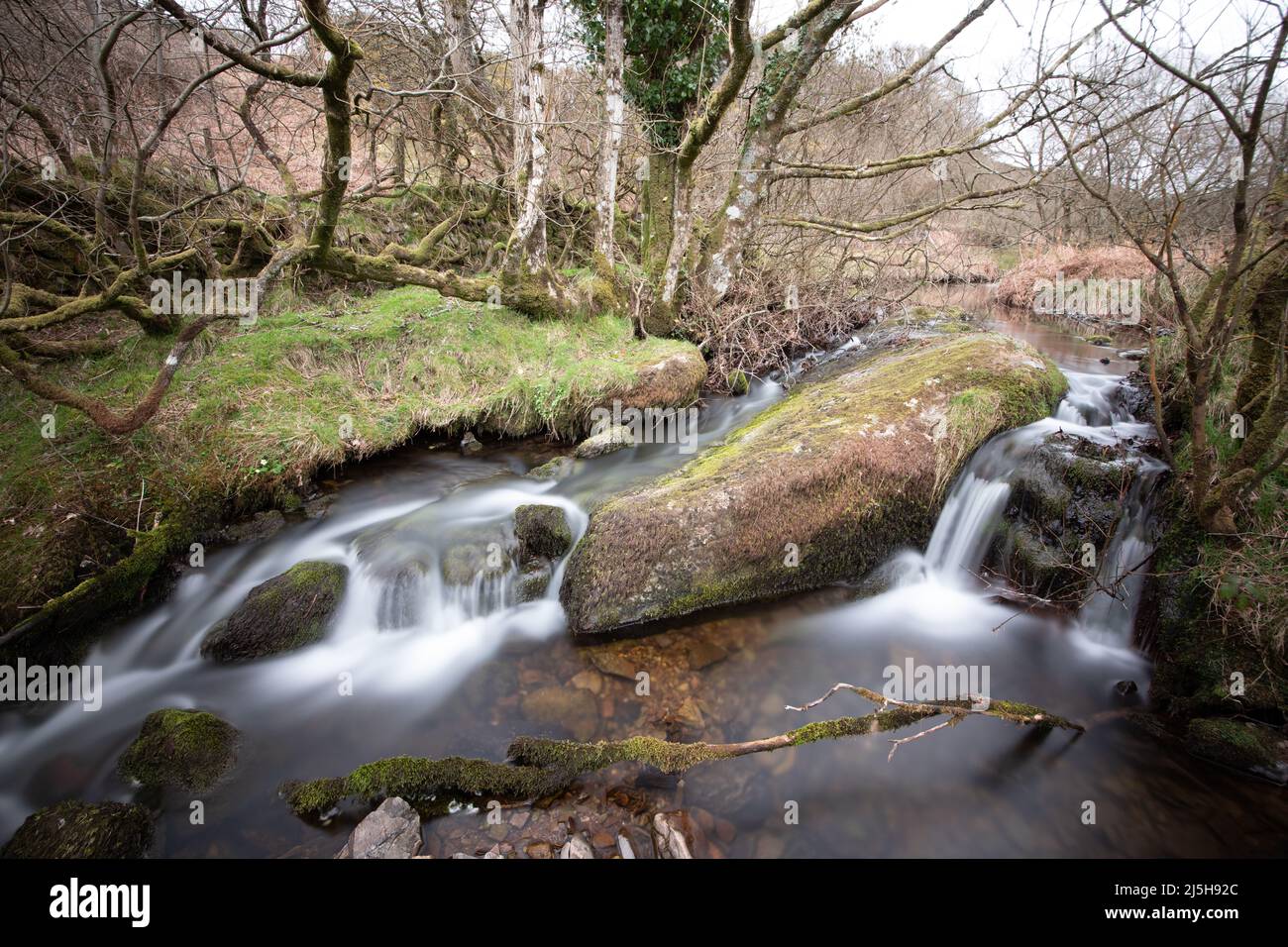 Long exposure of the Weir Water river flowing through the valley at ...