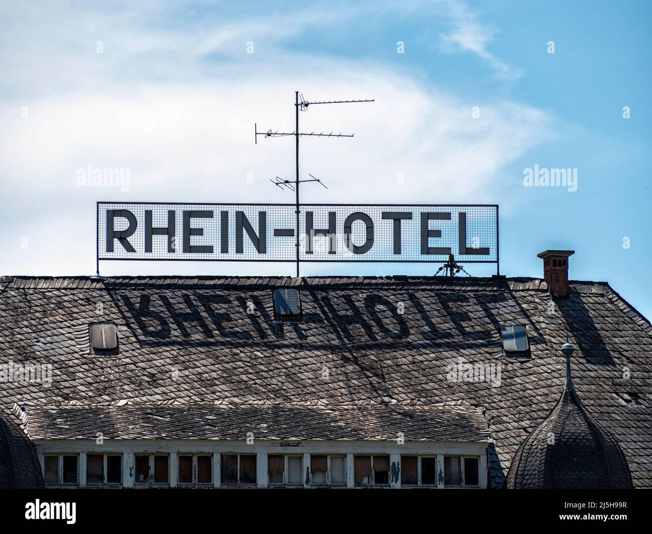 BAD SALZIG, GERMANY - JULY 06, 2019: Sign on the roof of the Rhein Hotel in the town Bad Salzig ...