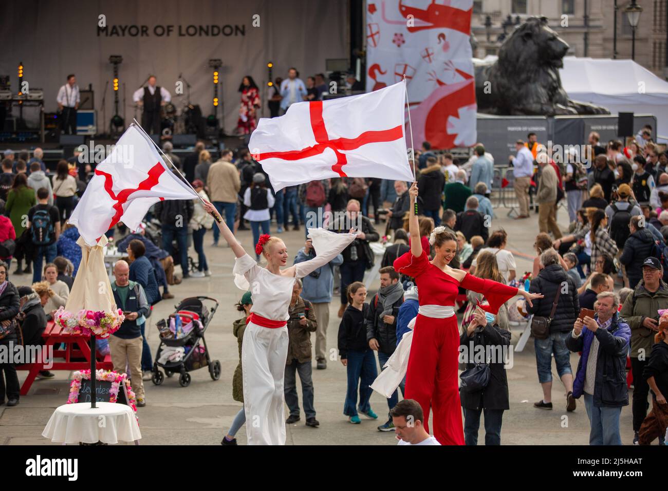Entertainers on stilts hold English flags at the Saint George's ...