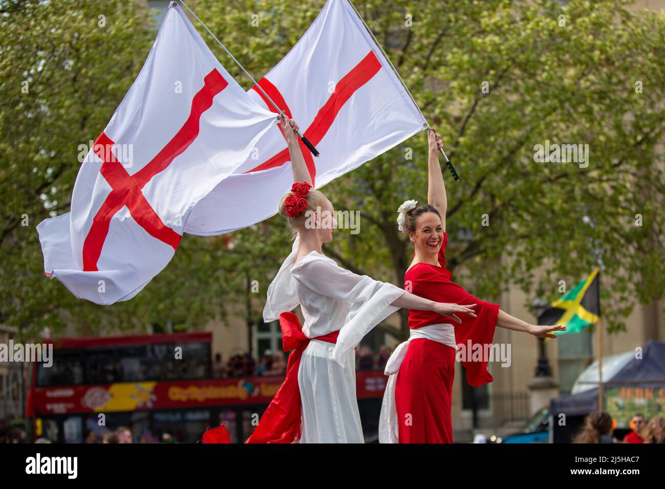 Entertainers on stilts hold English flags at the Saint George's ...