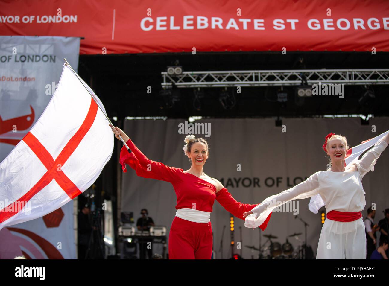 Entertainers on stilts hold English flags at the Saint George's ...