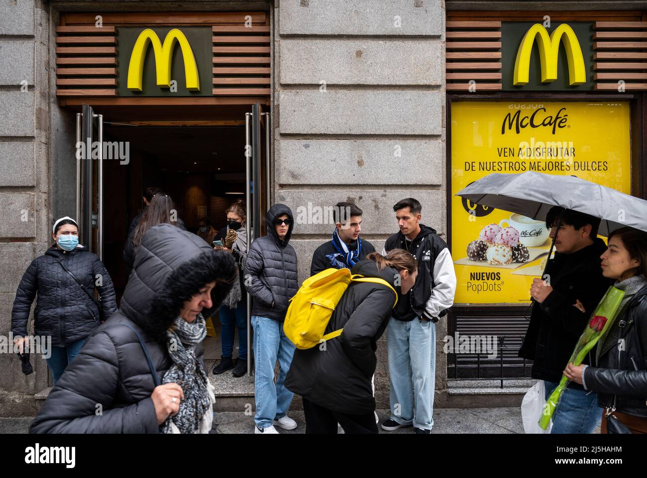 Pedestrians walk past the American multinational fast-food hamburger ...