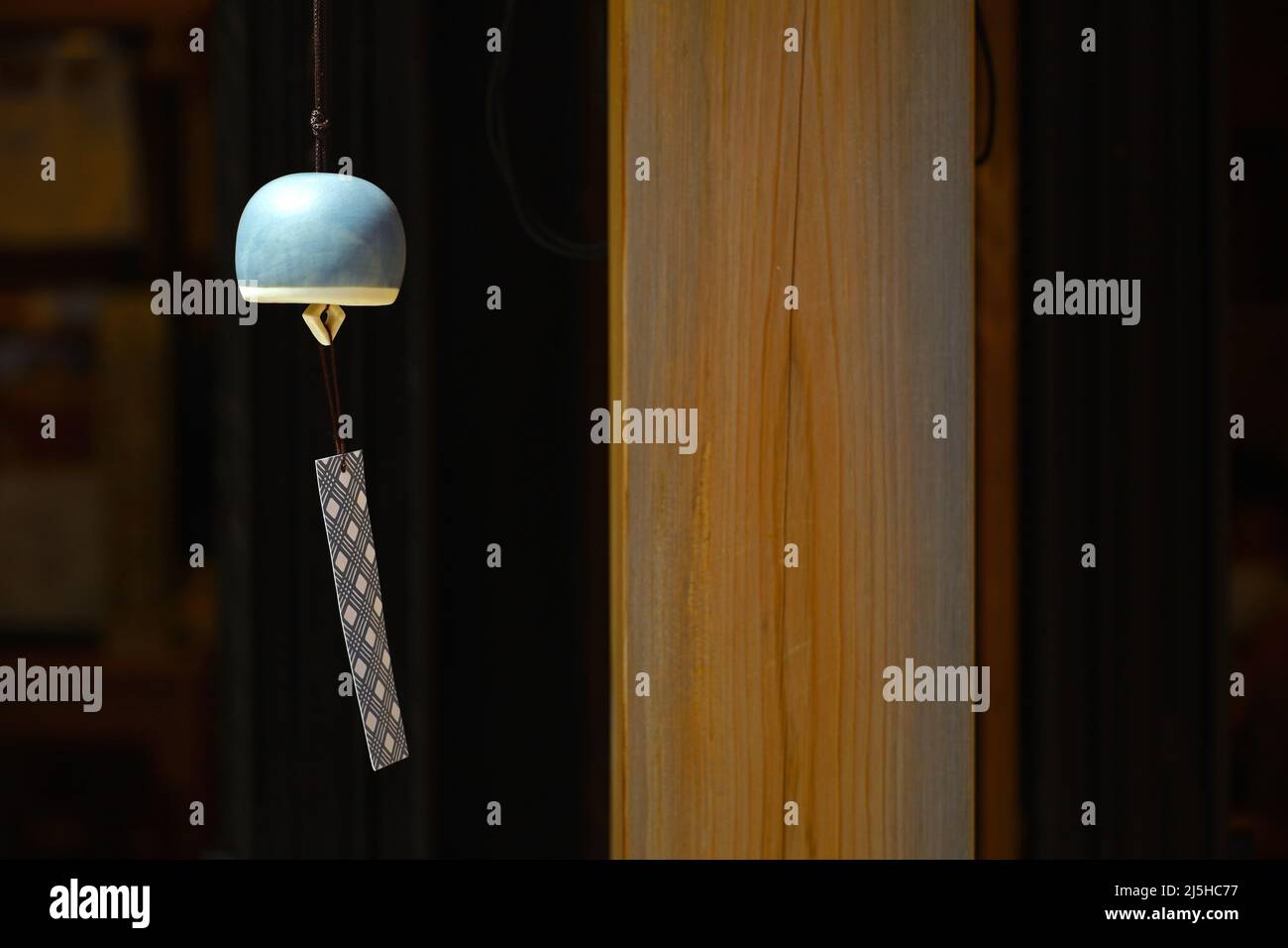 The eaves of a shop where a wind chime called "Furin", a Japanese ...