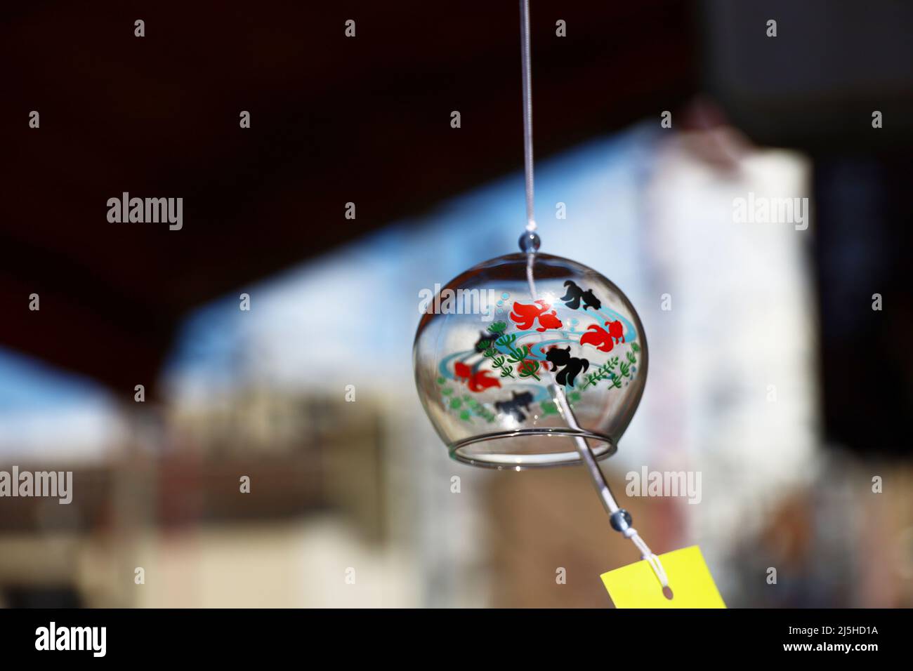 The eaves of a shop where a wind chime called "Furin", a Japanese ...