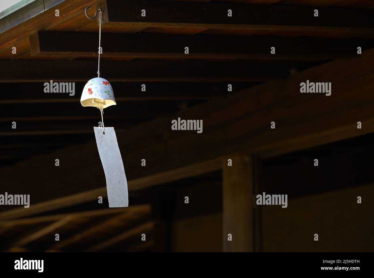 The eaves of a shop where a wind chime called "Furin", a Japanese ...