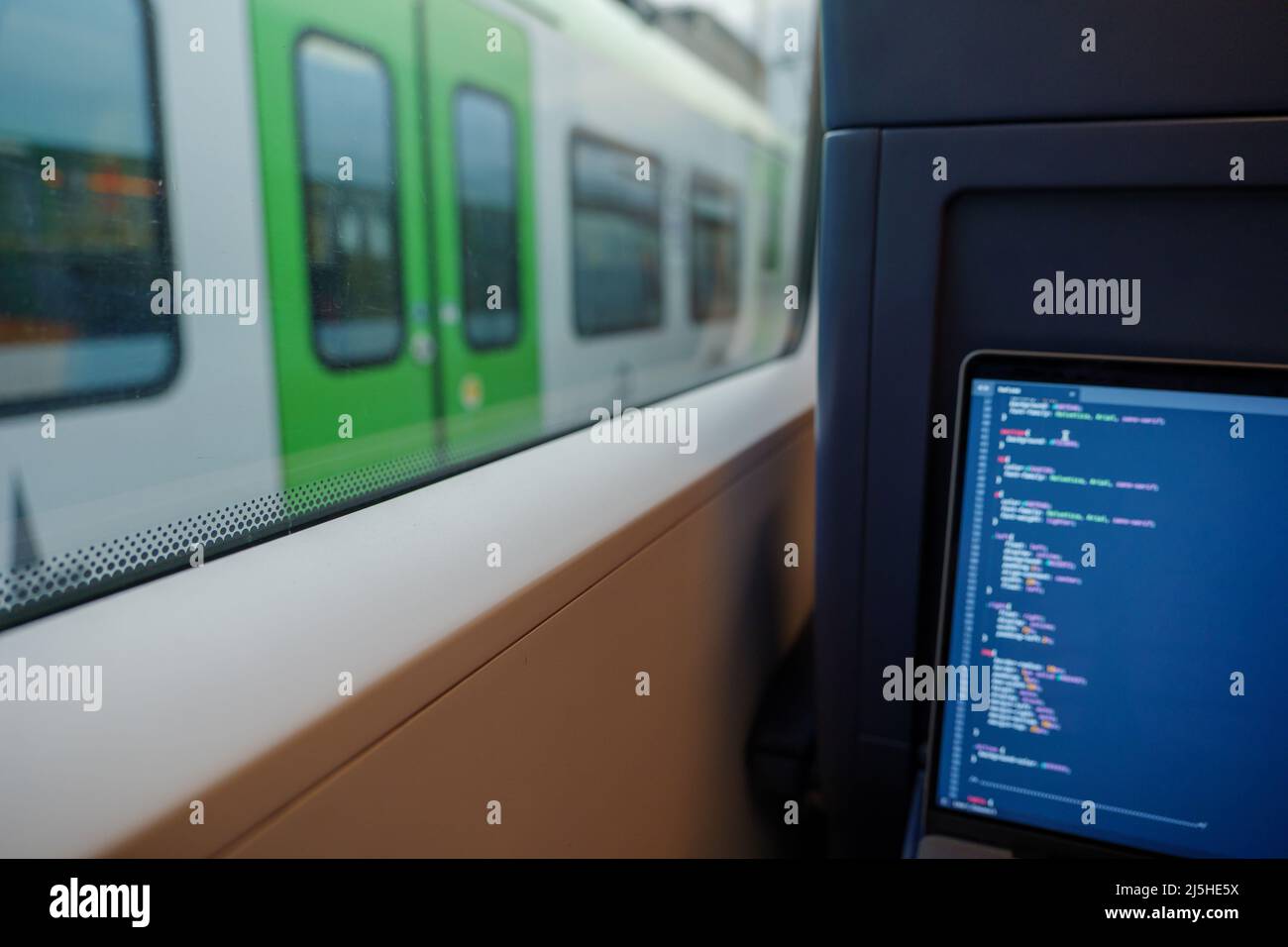 Man laptop train busy hi-res stock photography and images - Alamy