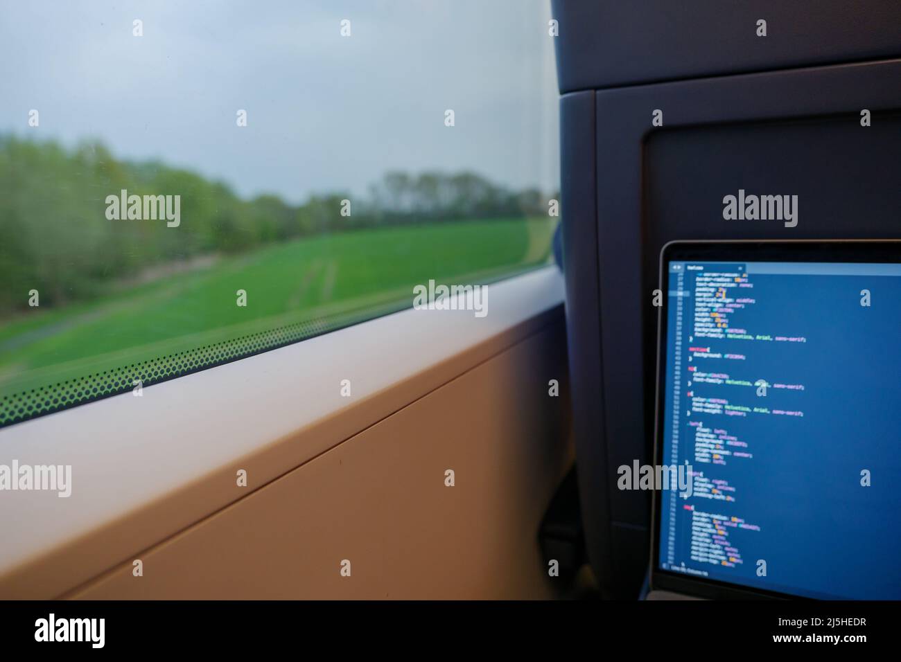 Selective Focus Open Laptop Or Notebook Working As Programmer And Do Some Coding On The Train