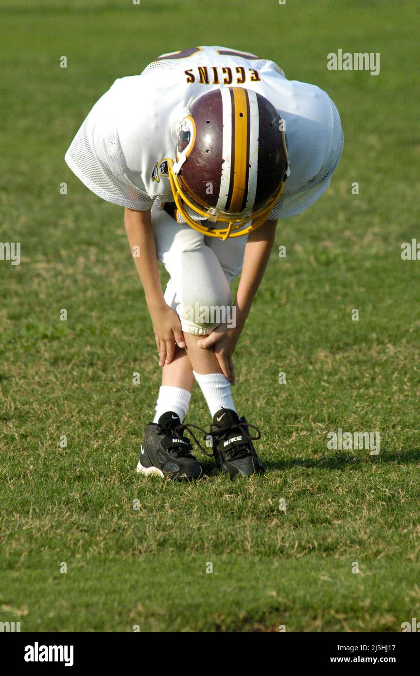 Kids football practice for full contact sport Stock Photo - Alamy