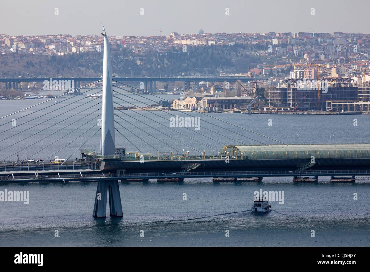 Aerial zoomed in view of the Golden Horn Metro Bridge and the Golden ...