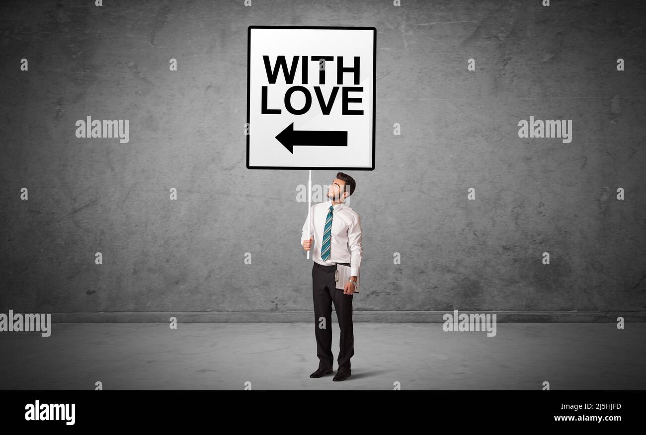 business person holding a traffic sign Stock Photo - Alamy
