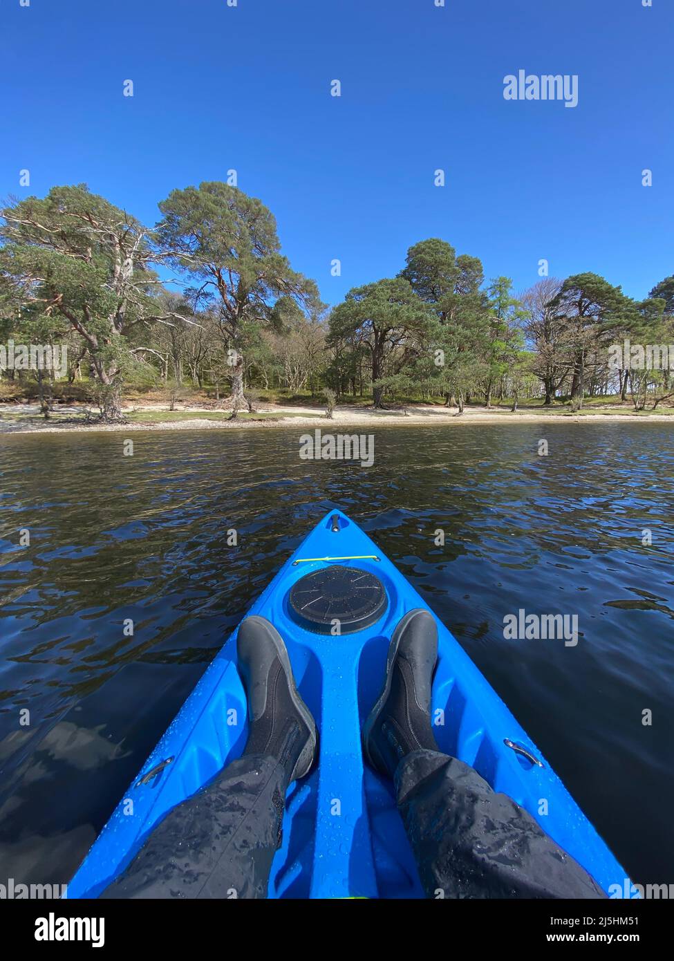 Blue kayak on open water at Loch Lomond Stock Photo - Alamy