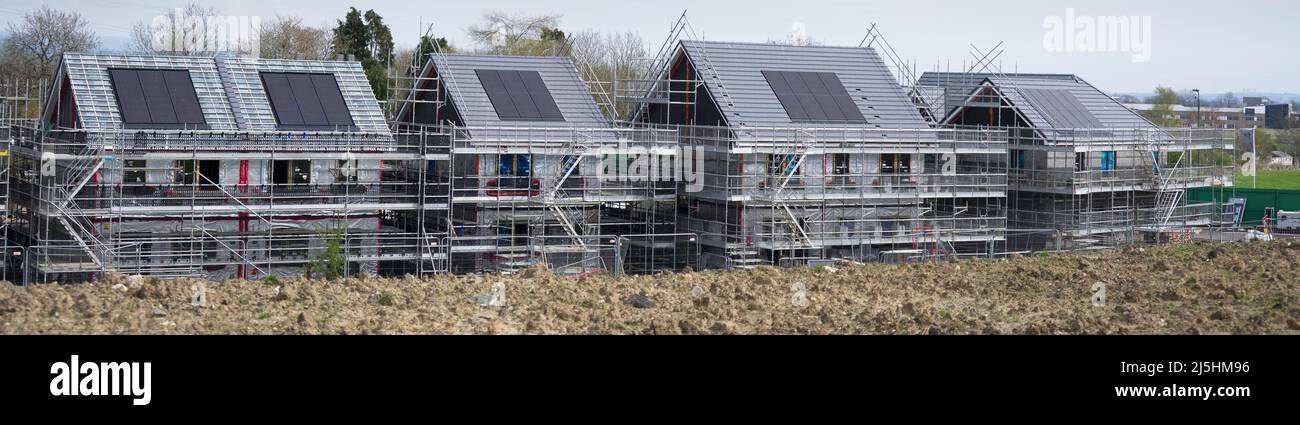 Solar panels installed on new houses being built Stock Photo - Alamy