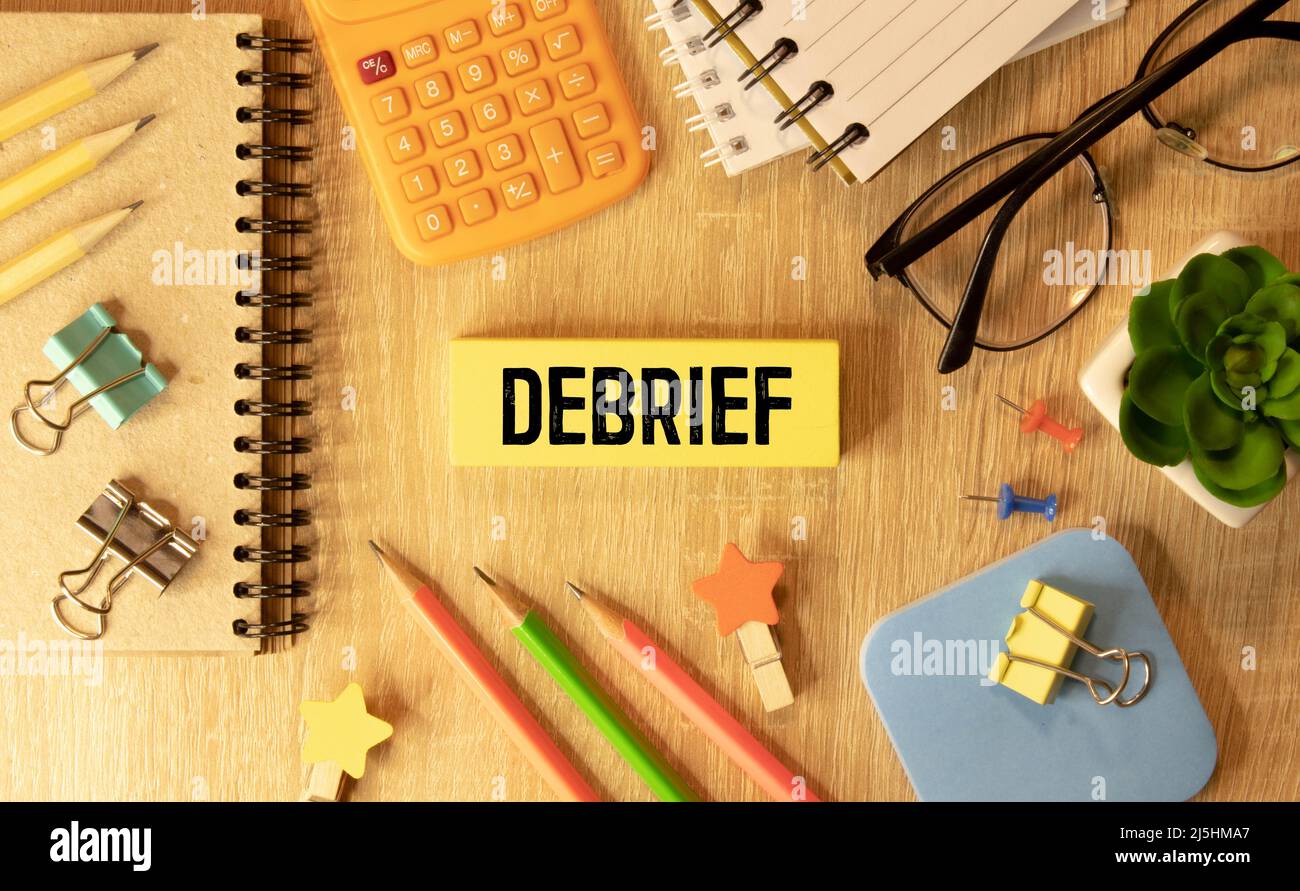 debrief word in a dictionary. debrief concept Stock Photo - Alamy