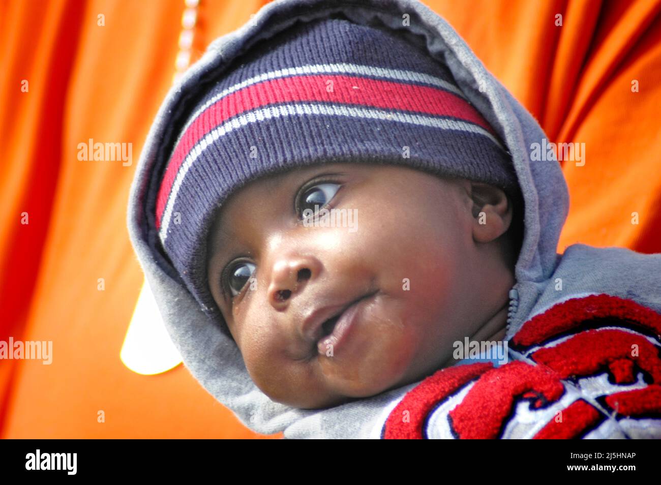 Black boy baby with cap and full face Stock Photo - Alamy