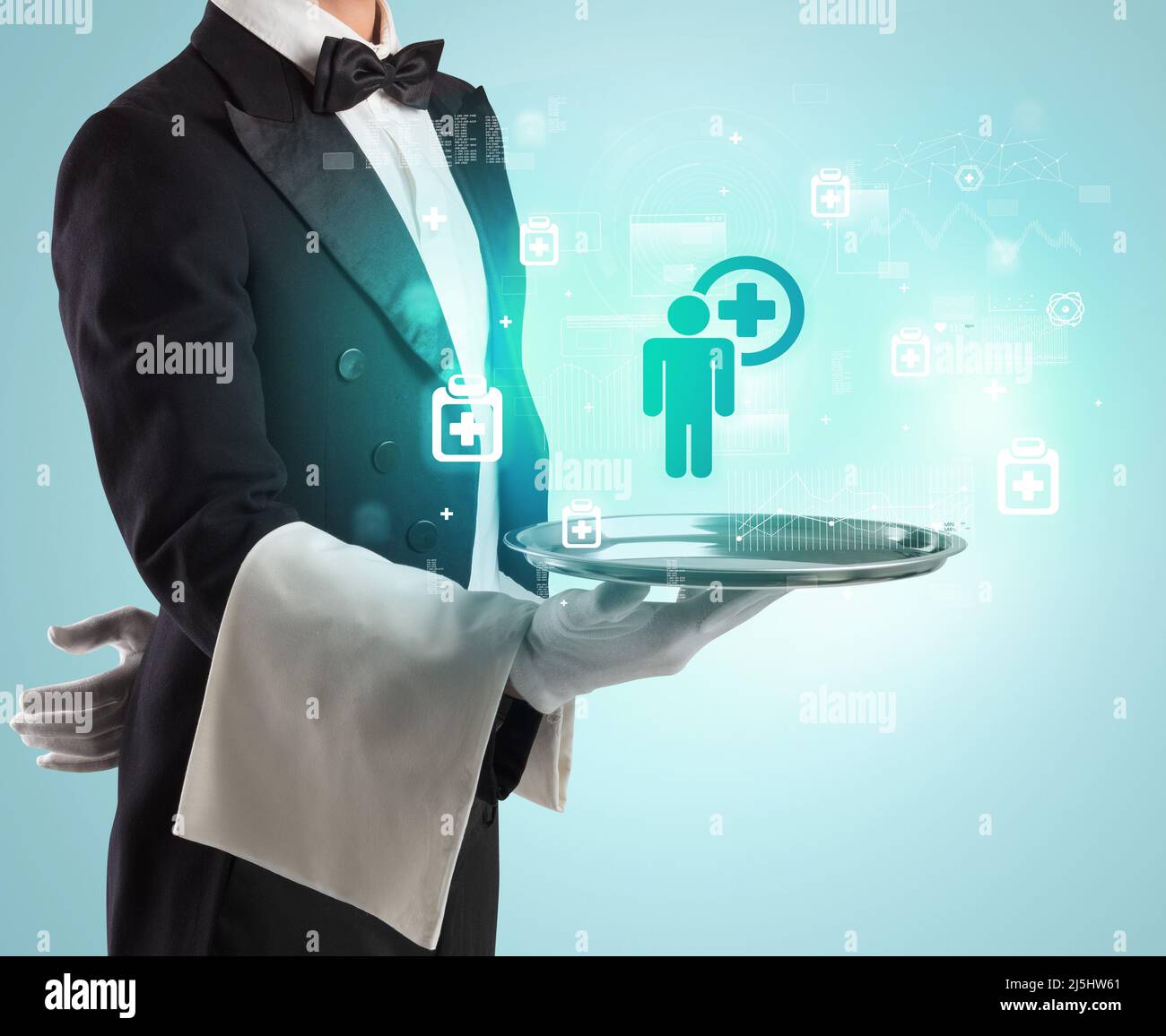 Handsome young waiter in tuxedo holding healthcare icons on tray Stock ...