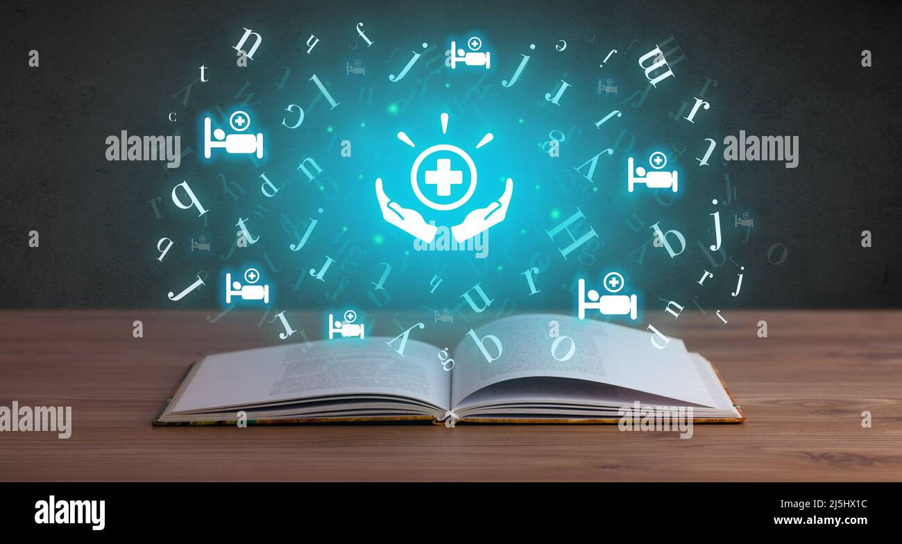 Open medical book with health icons above Stock Photo - Alamy