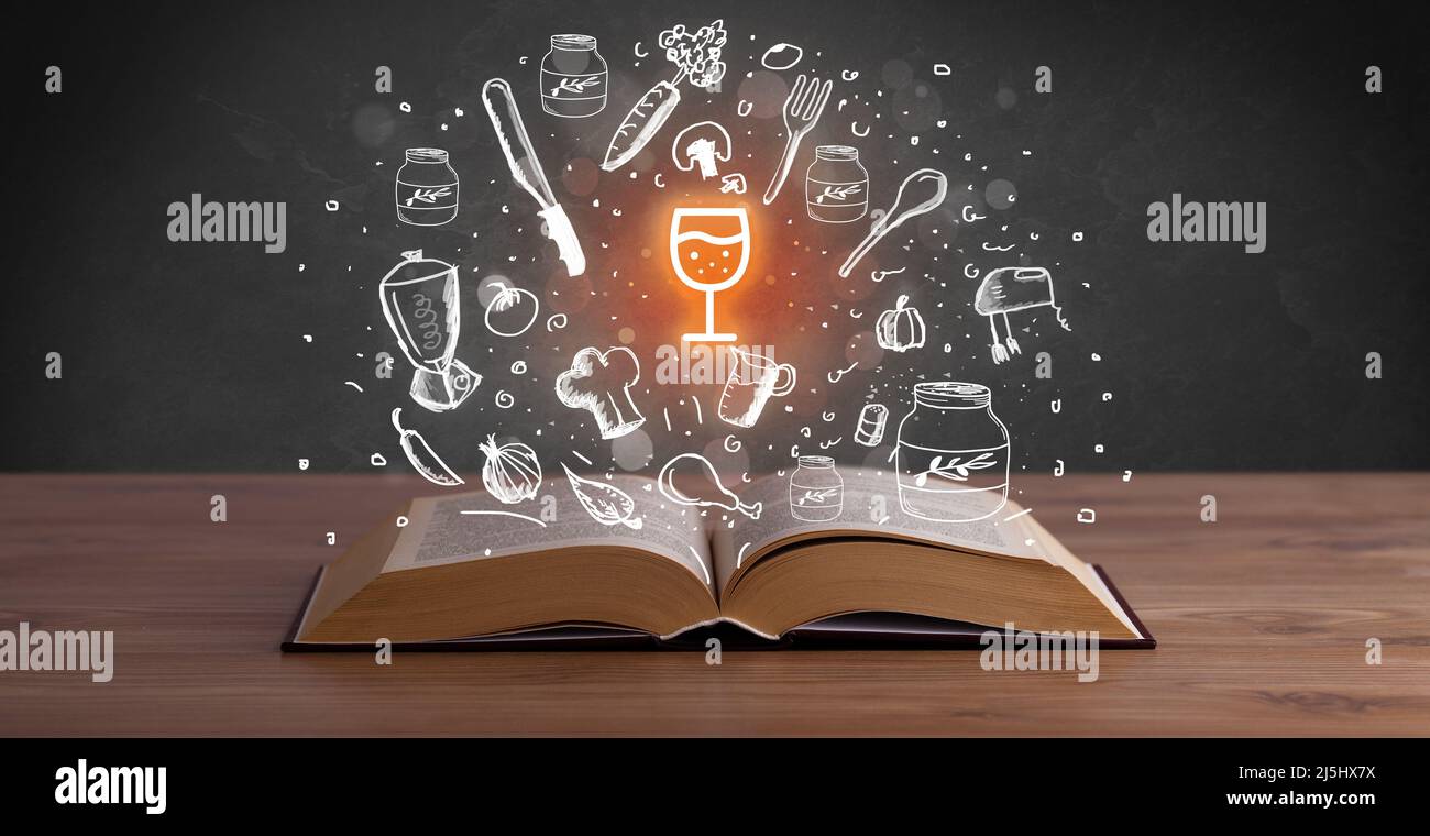 Open recipe book with food related icons above Stock Photo - Alamy