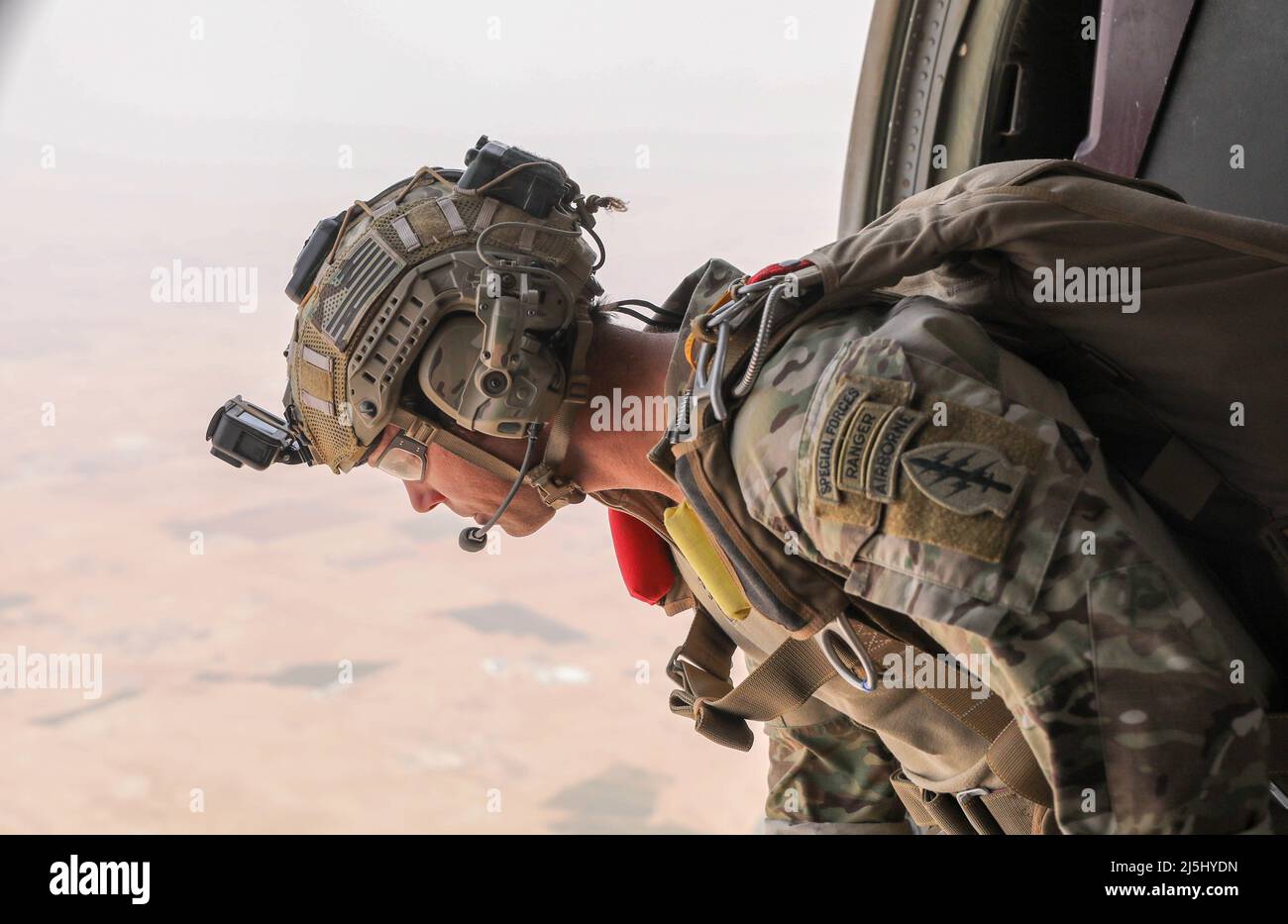 ZARQA, Jordan – US Special Forces operator looks down to the drop zone ...