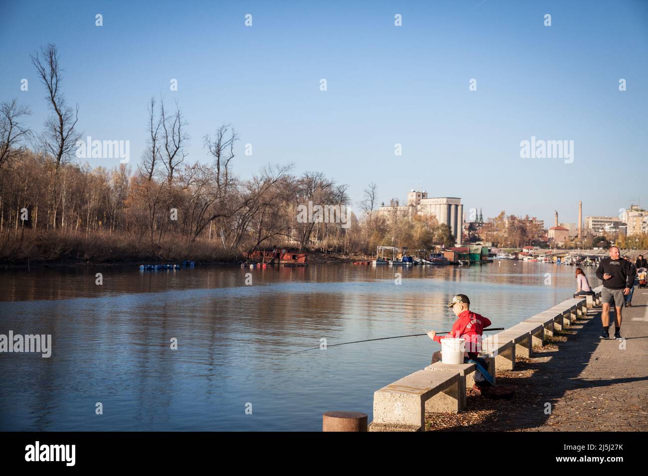 Picture of a kid fishing in the waters of the Tamis river in Pancevo ...