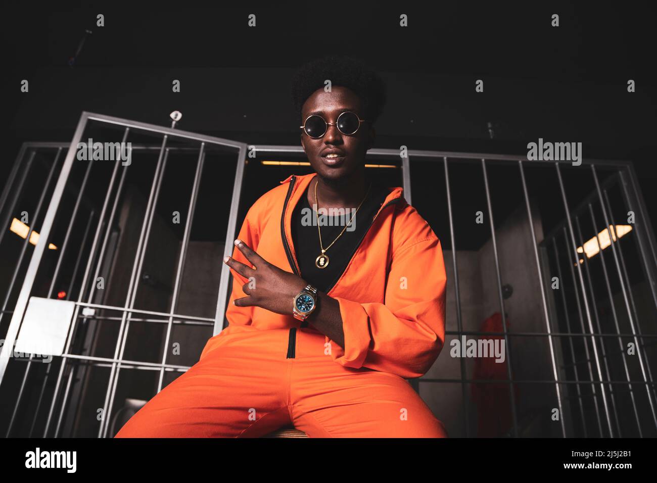 Black prisoner posing in front of his cell Stock Photo - Alamy