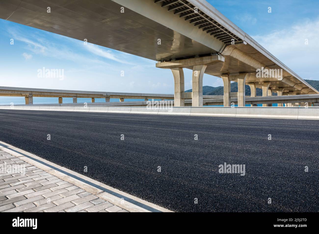 Empty asphalt road and bridge building background Stock Photo - Alamy