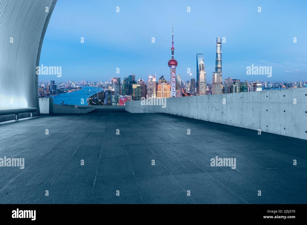 Empty square floor and city skyline with buildings in Shanghai at night ...